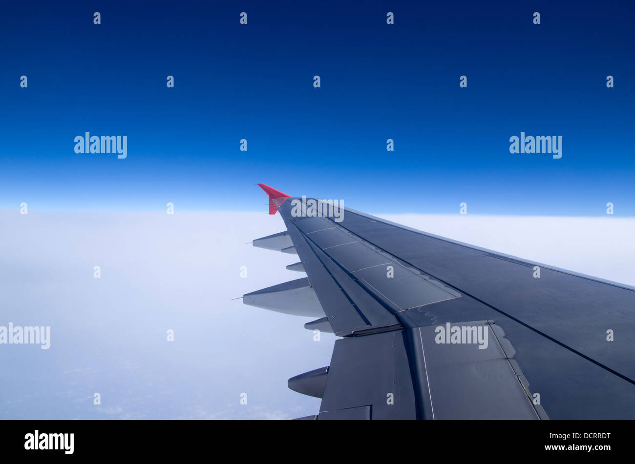 View out of airplane Airplane wing in flight Stock Photo - Alamy
