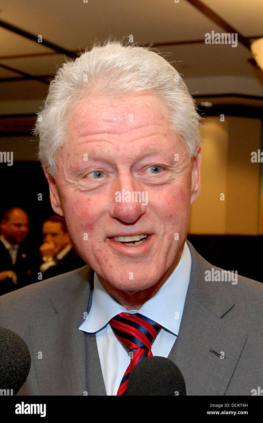 Former U.S. President Bill Clinton signs copies of "Back to Work: Why ...