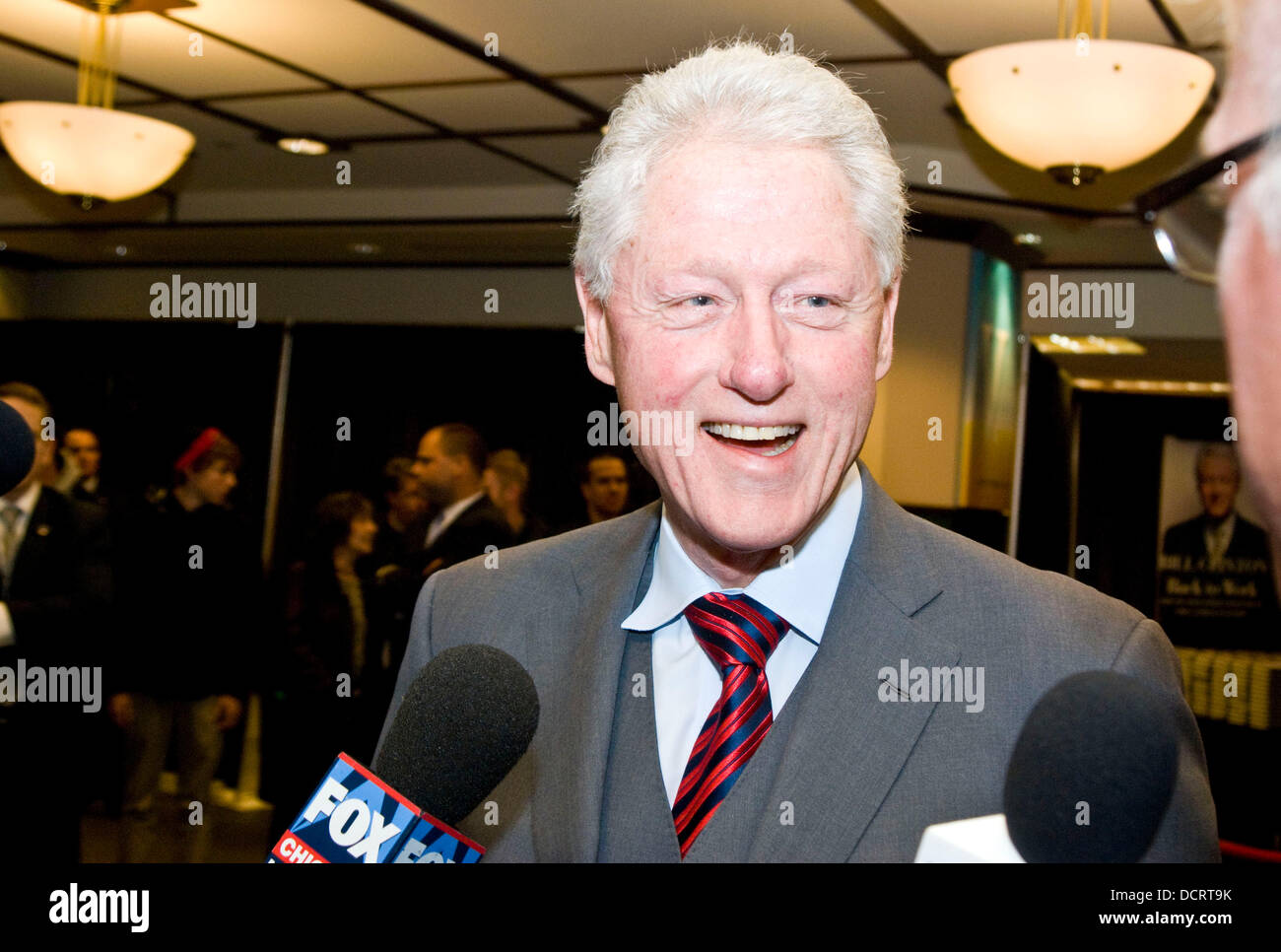 Former U.S. President Bill Clinton signs copies of "Back to Work: Why ...