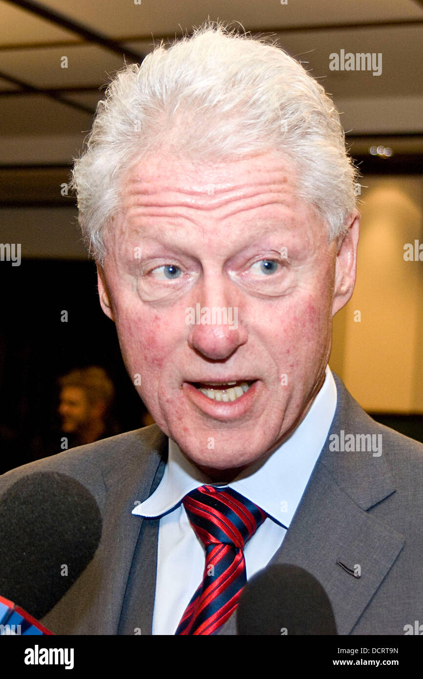 Former U.S. President Bill Clinton signs copies of "Back to Work: Why ...