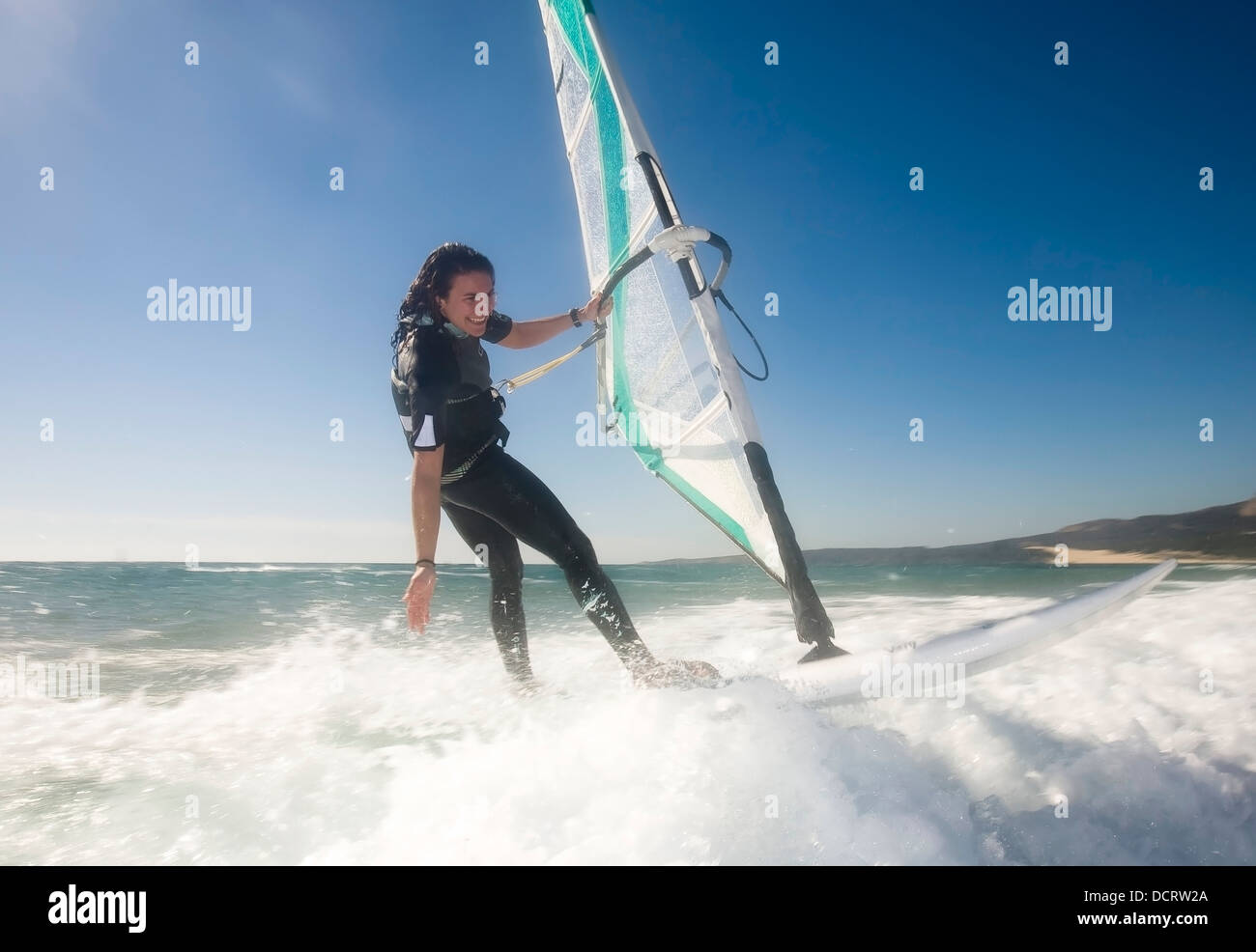 Young Woman Windsurfing Stock Photo - Alamy