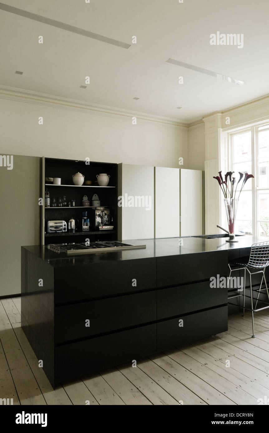 Minotti kitchen with streamlined cupboards and granite island with ...