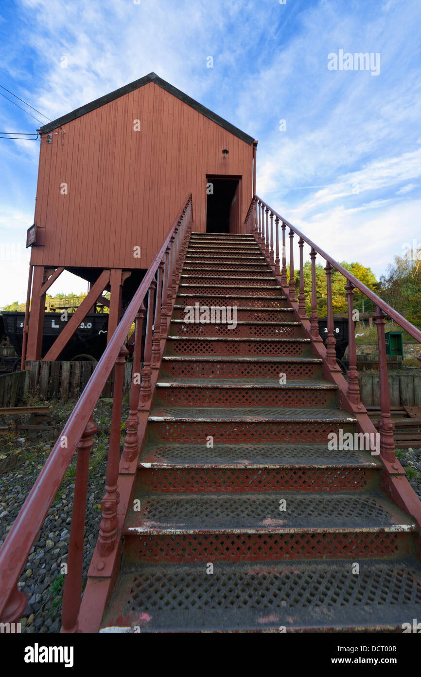 Stairs Leading Up To An Elevated Building Along The Train Tracks ...