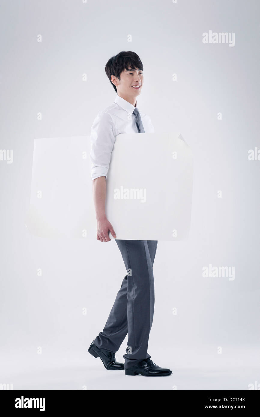 a business man carrying a blank paper Stock Photo - Alamy