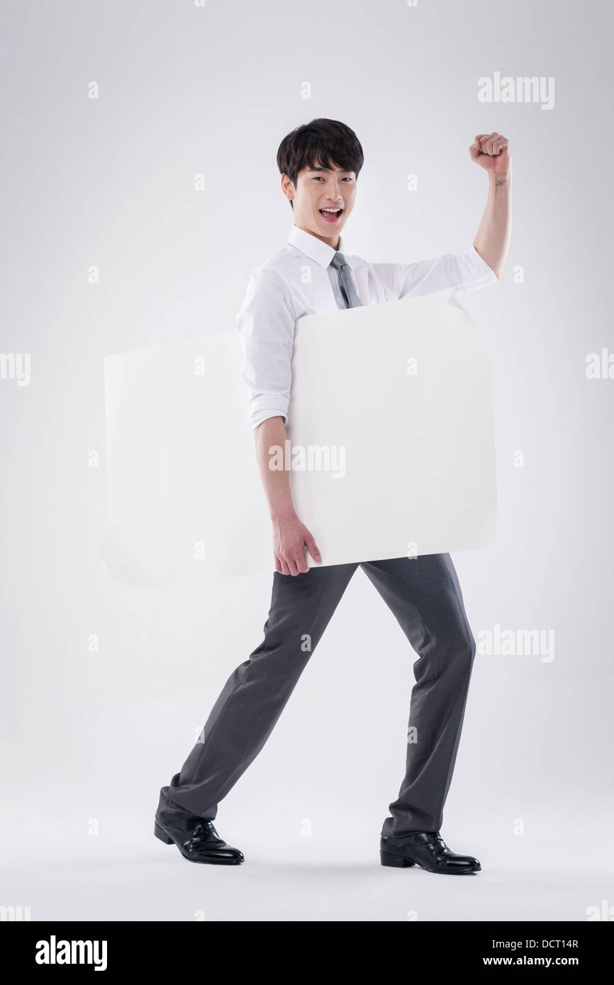 a business man carrying a blank paper Stock Photo - Alamy