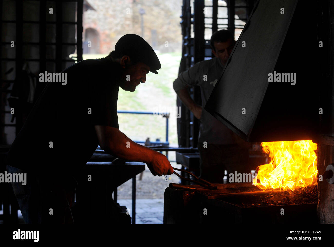 Five forgers from Israel work on metal sculpture of a bird during Forge ...