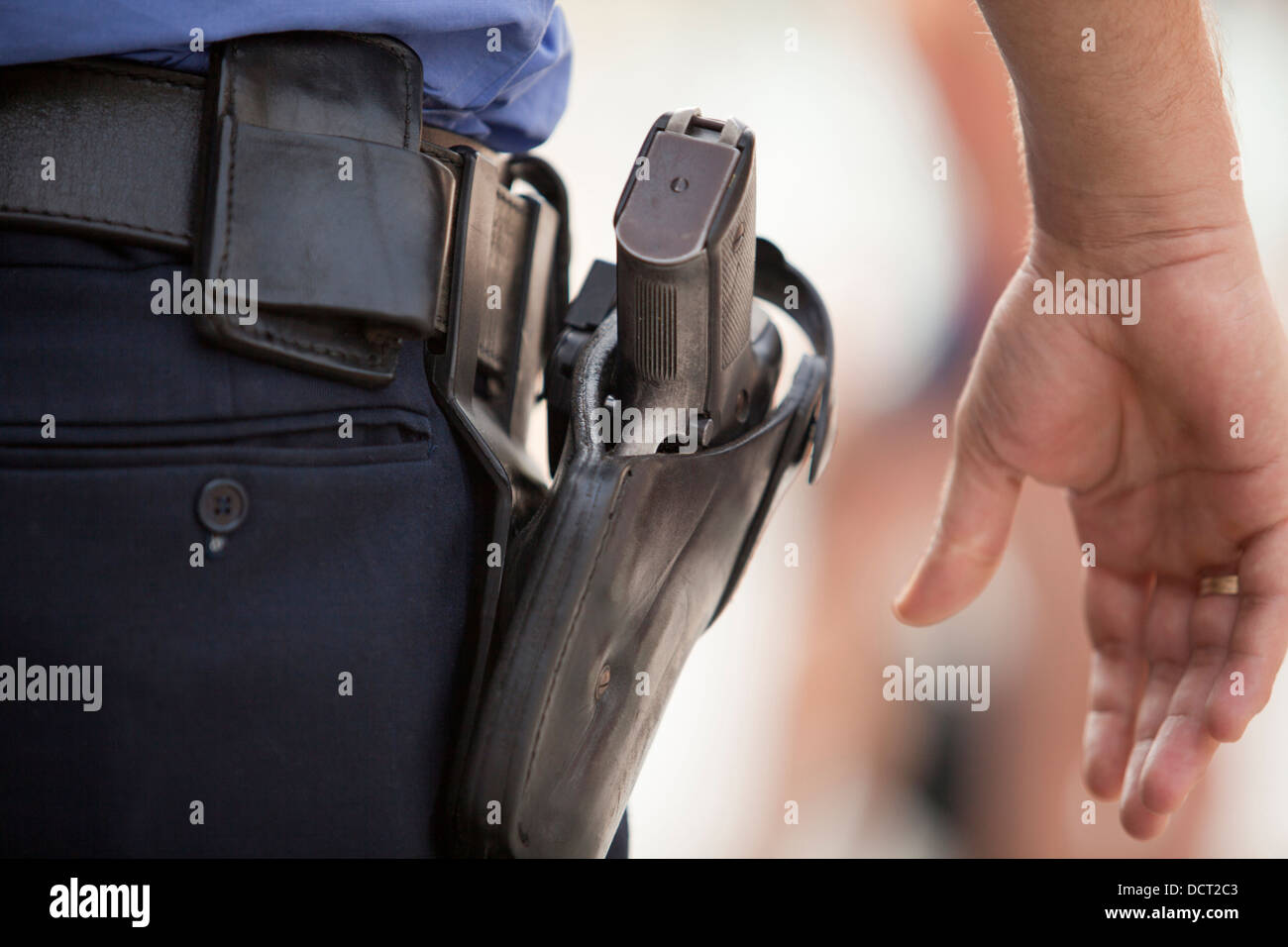 Policeman gun hi-res stock photography and images - Alamy
