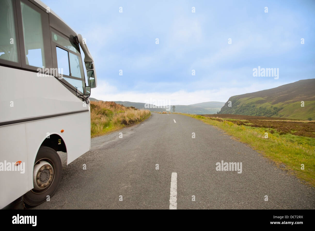 A Bus Traveling Down A Road; County Wicklow, Ireland Stock Photo - Alamy
