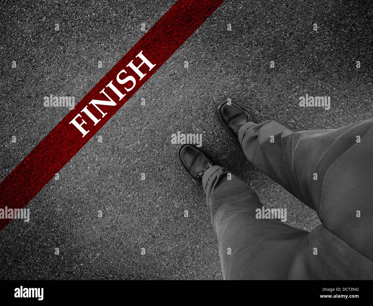 Finish line with businessman wearing dress shoes as metaphor for ...