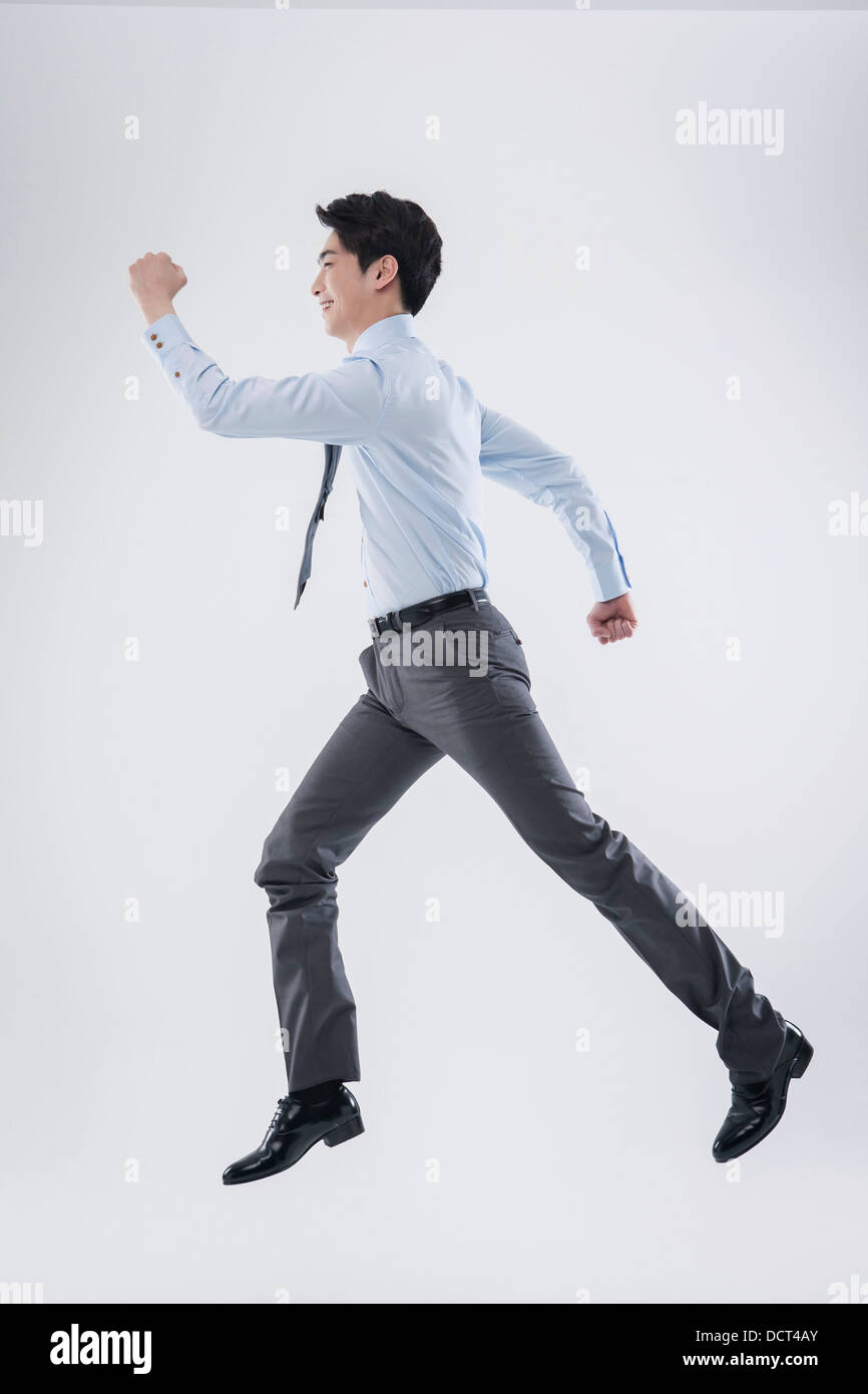 a business man running Stock Photo - Alamy