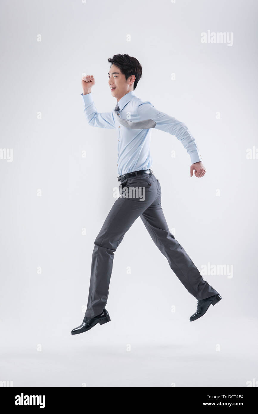 a business man running Stock Photo - Alamy