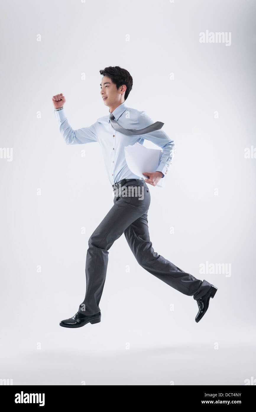 a business man running Stock Photo - Alamy