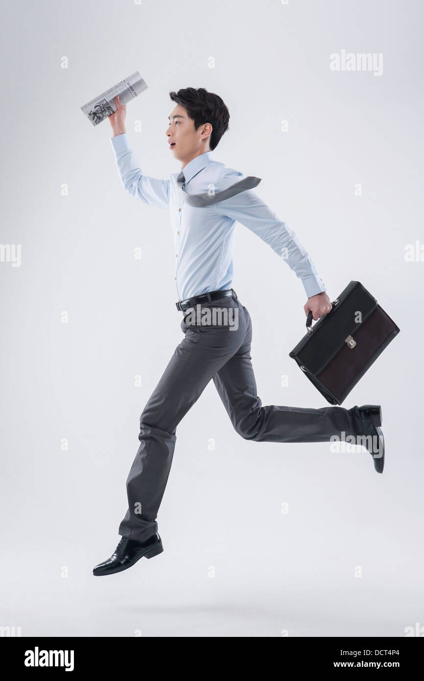 a business man running Stock Photo - Alamy