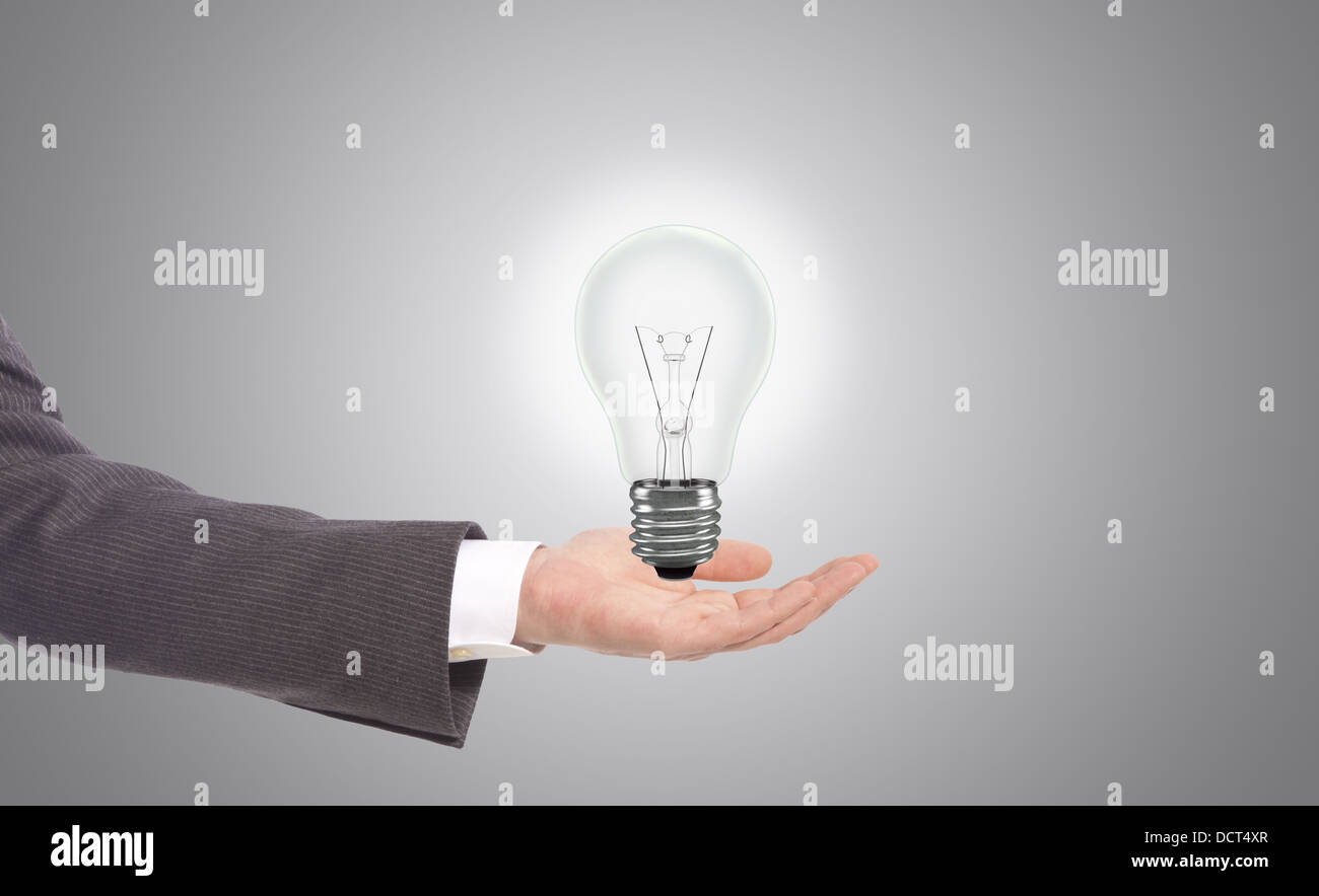 Light bulb in a hand Stock Photo - Alamy