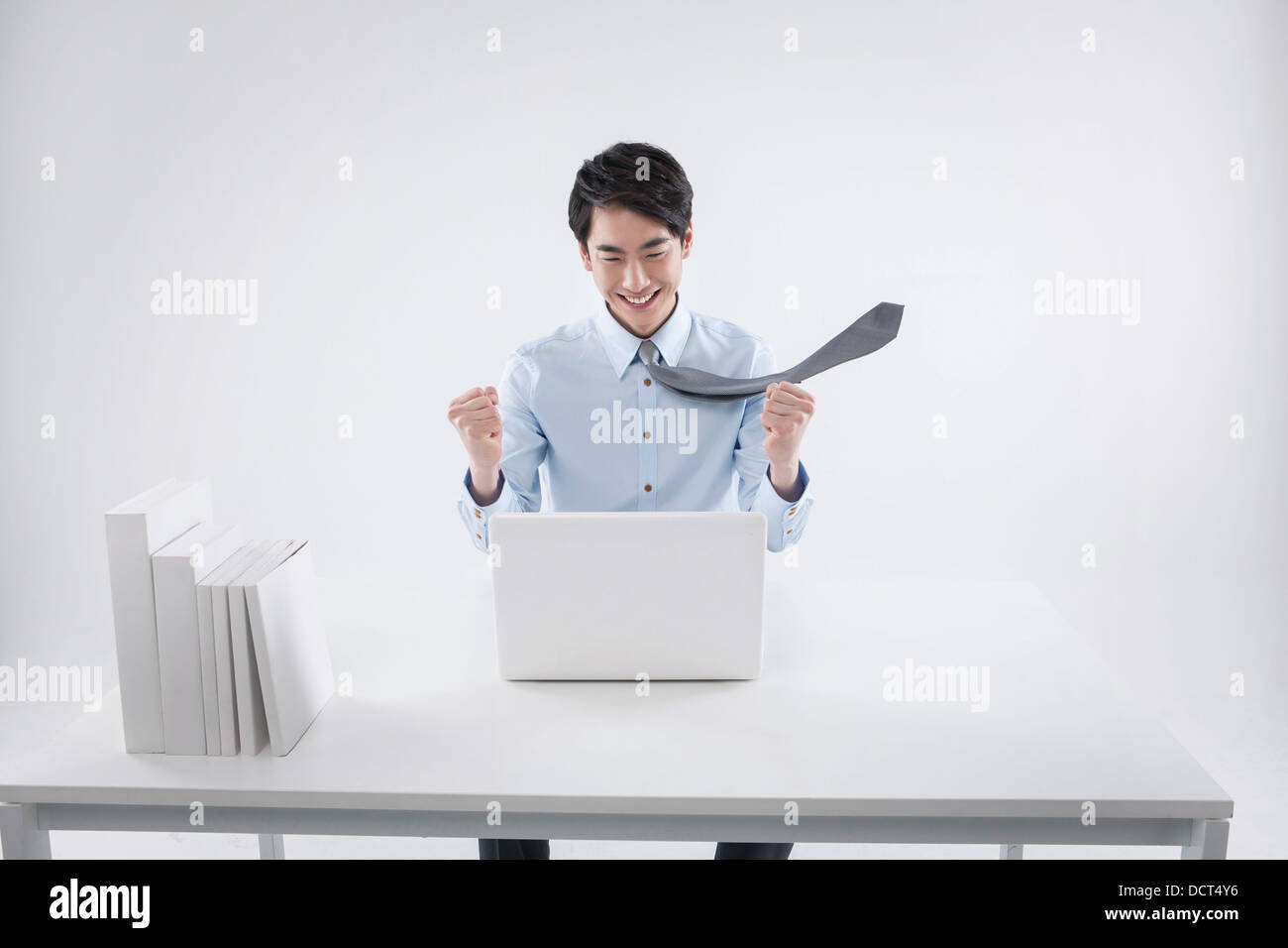 a business man sitting at a desk Stock Photo - Alamy