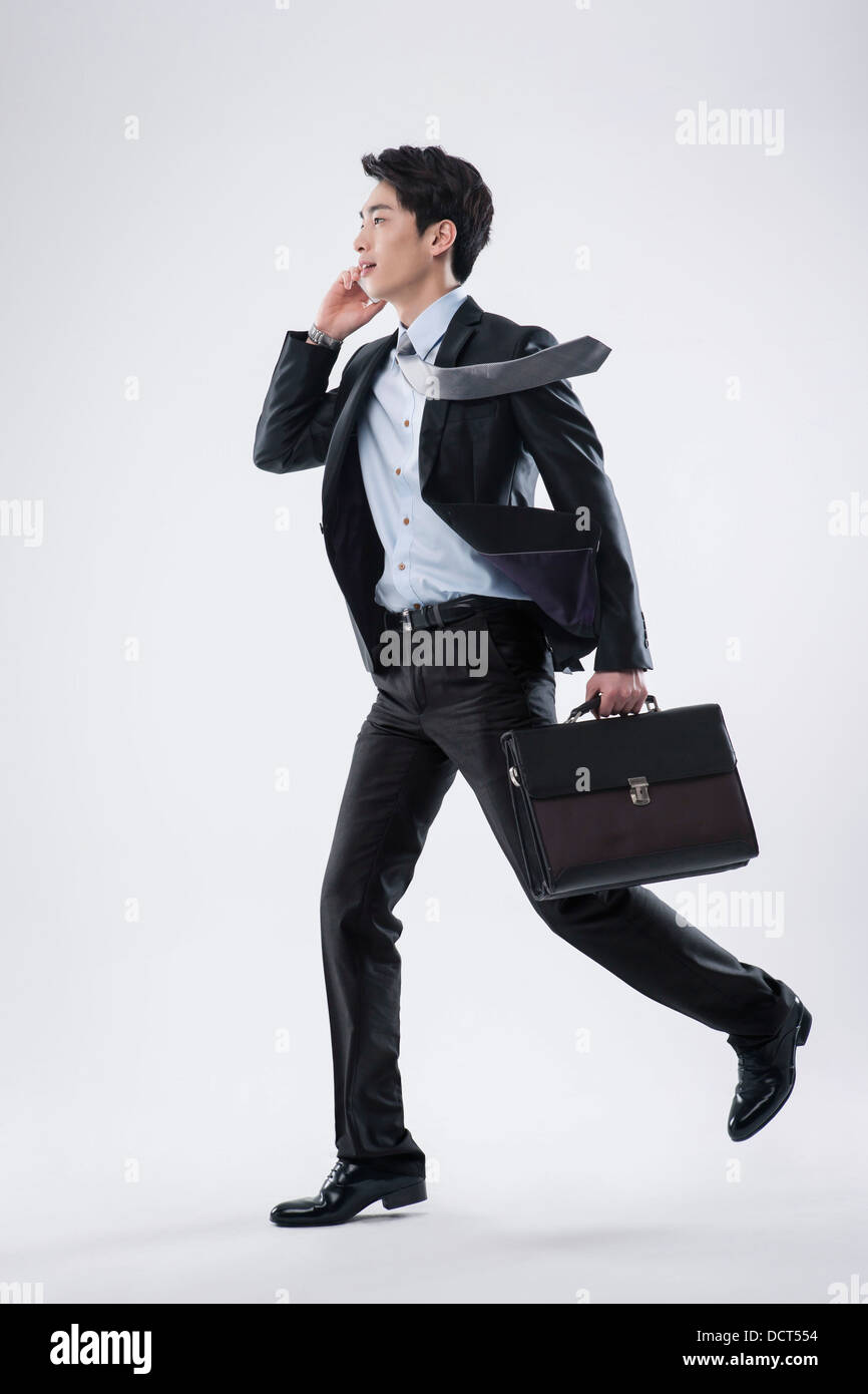 a business man running Stock Photo - Alamy