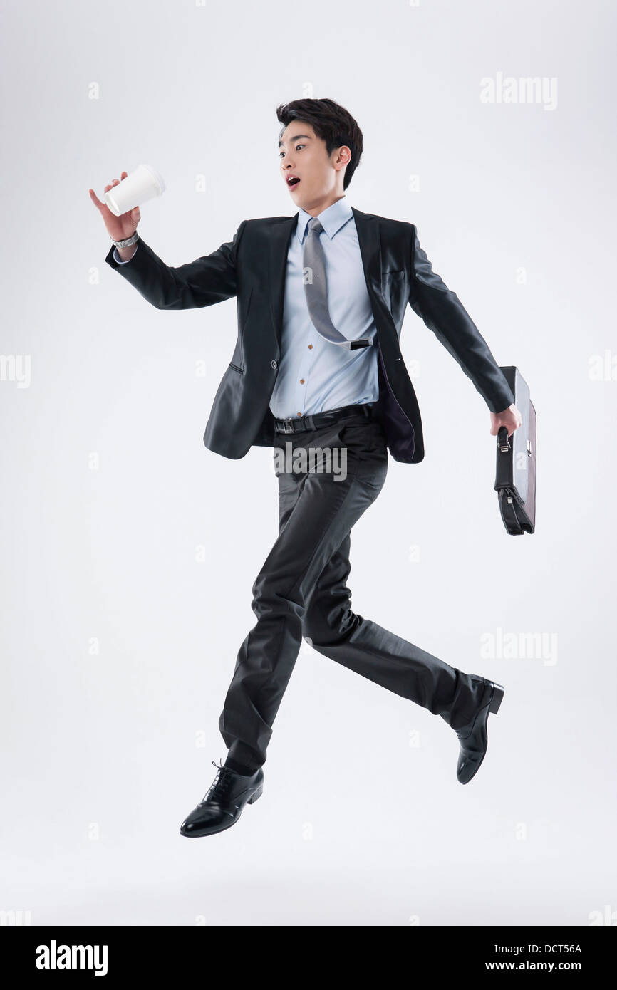 a business man running Stock Photo - Alamy