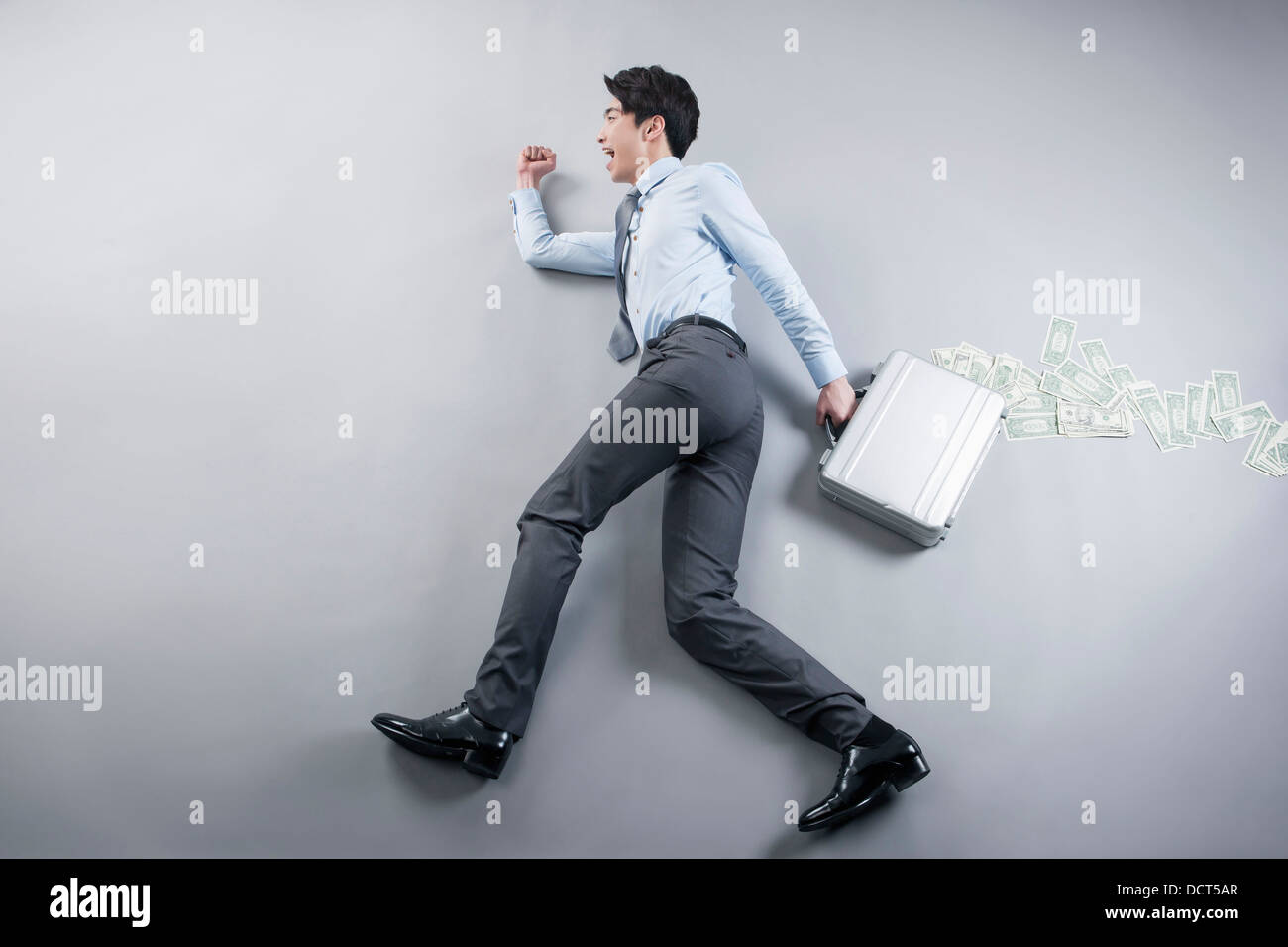 a business man lying on the floor in a walking pose Stock Photo - Alamy