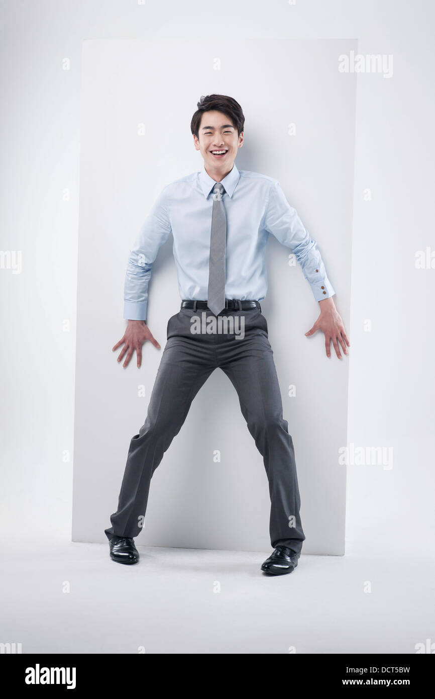 a business man leaning at a block Stock Photo - Alamy