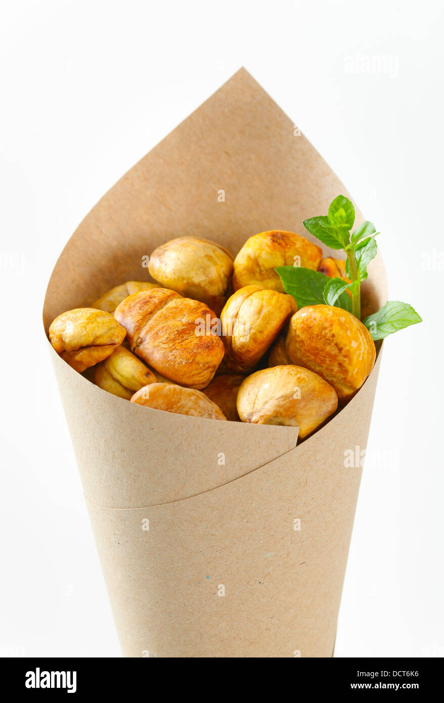 Peeled roasted chestnuts in a paper cone Stock Photo - Alamy