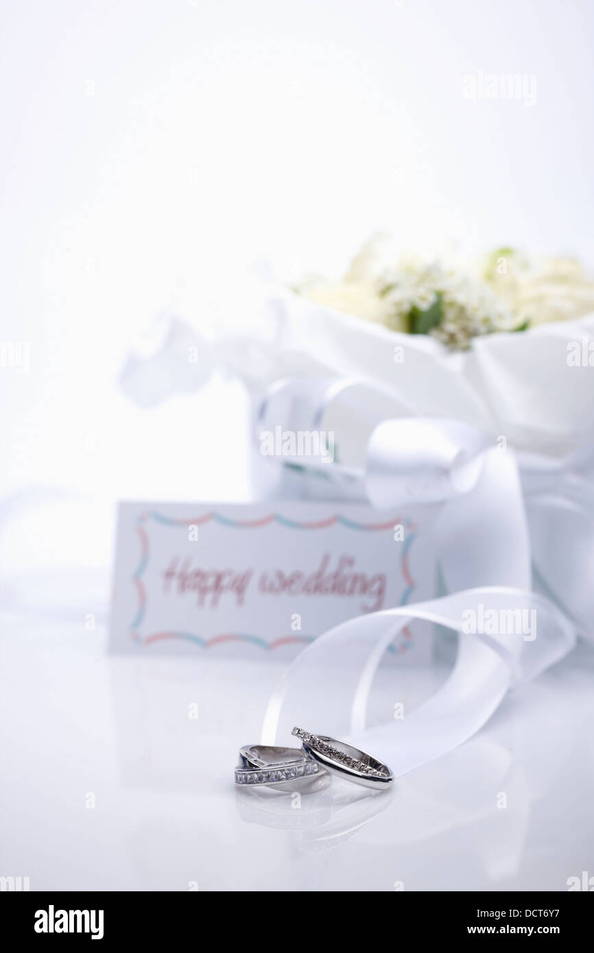 a wedding card with wedding rings Stock Photo - Alamy