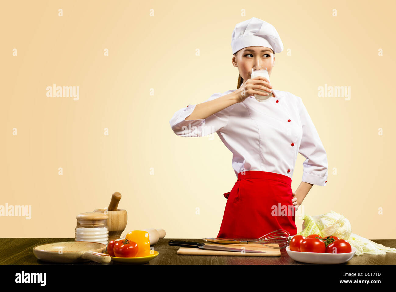 Asian female cook drinking milk Stock Photo - Alamy