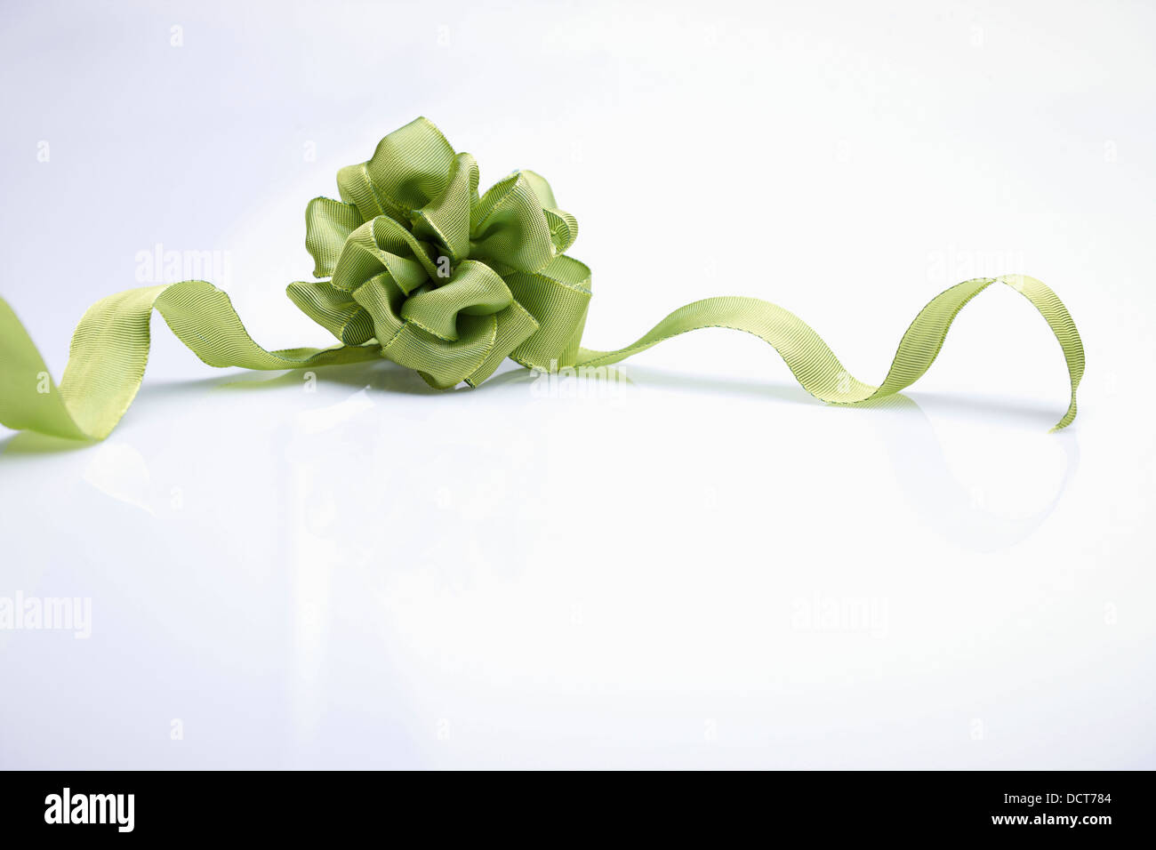 green ribbon with a flower Stock Photo - Alamy