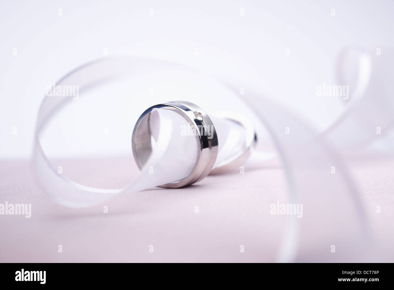 wedding rings in a white ribbon Stock Photo - Alamy