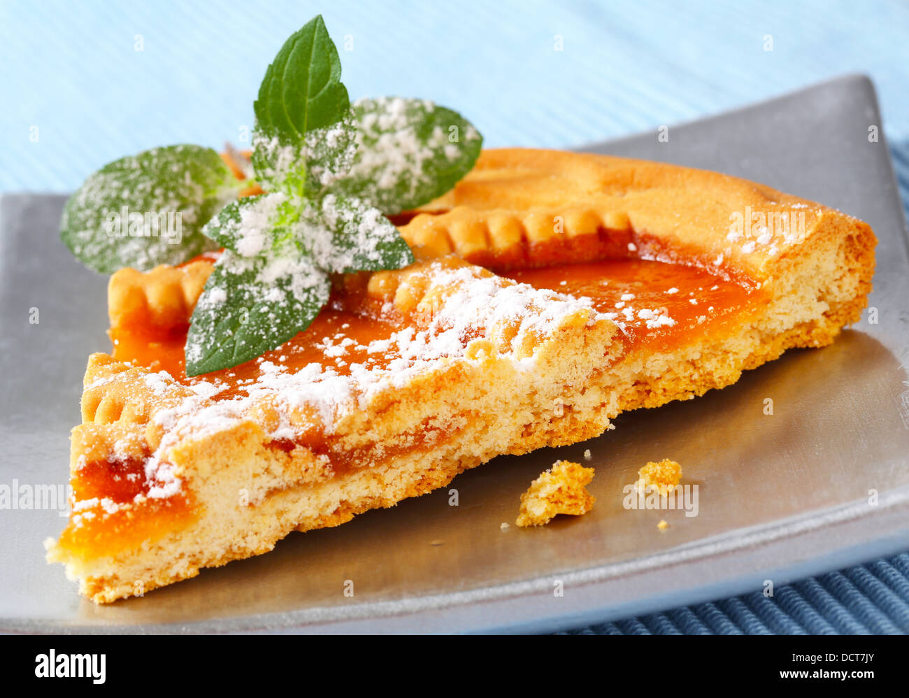 Slice of Linzer apricot tart Stock Photo - Alamy
