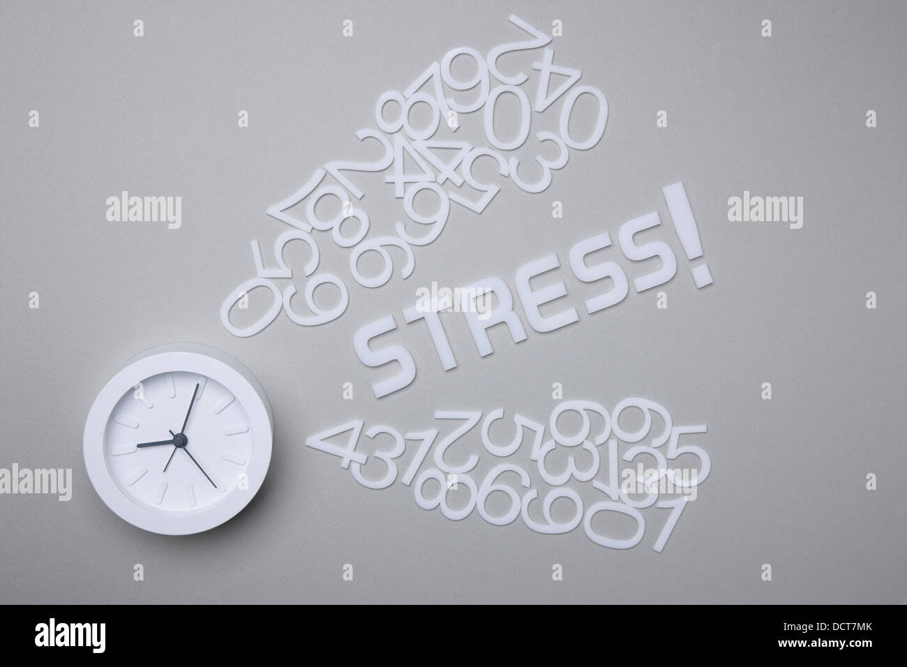 a clock and the word stress Stock Photo - Alamy