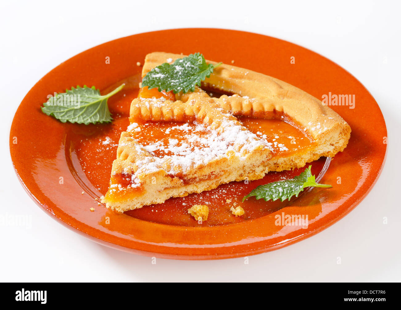 Slice of Linzer apricot tart Stock Photo - Alamy