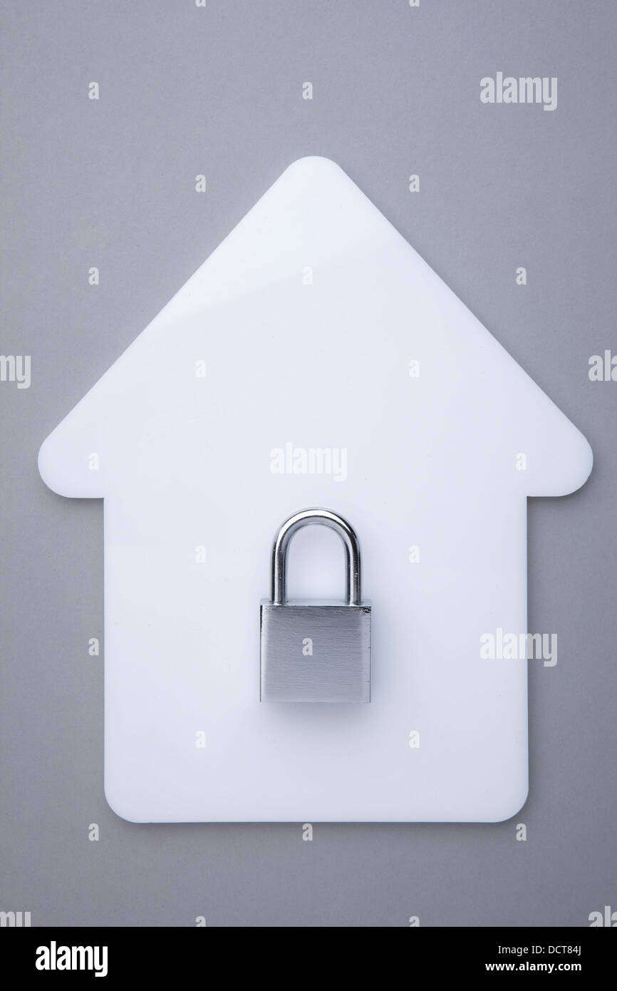 a house shape with a lock Stock Photo - Alamy