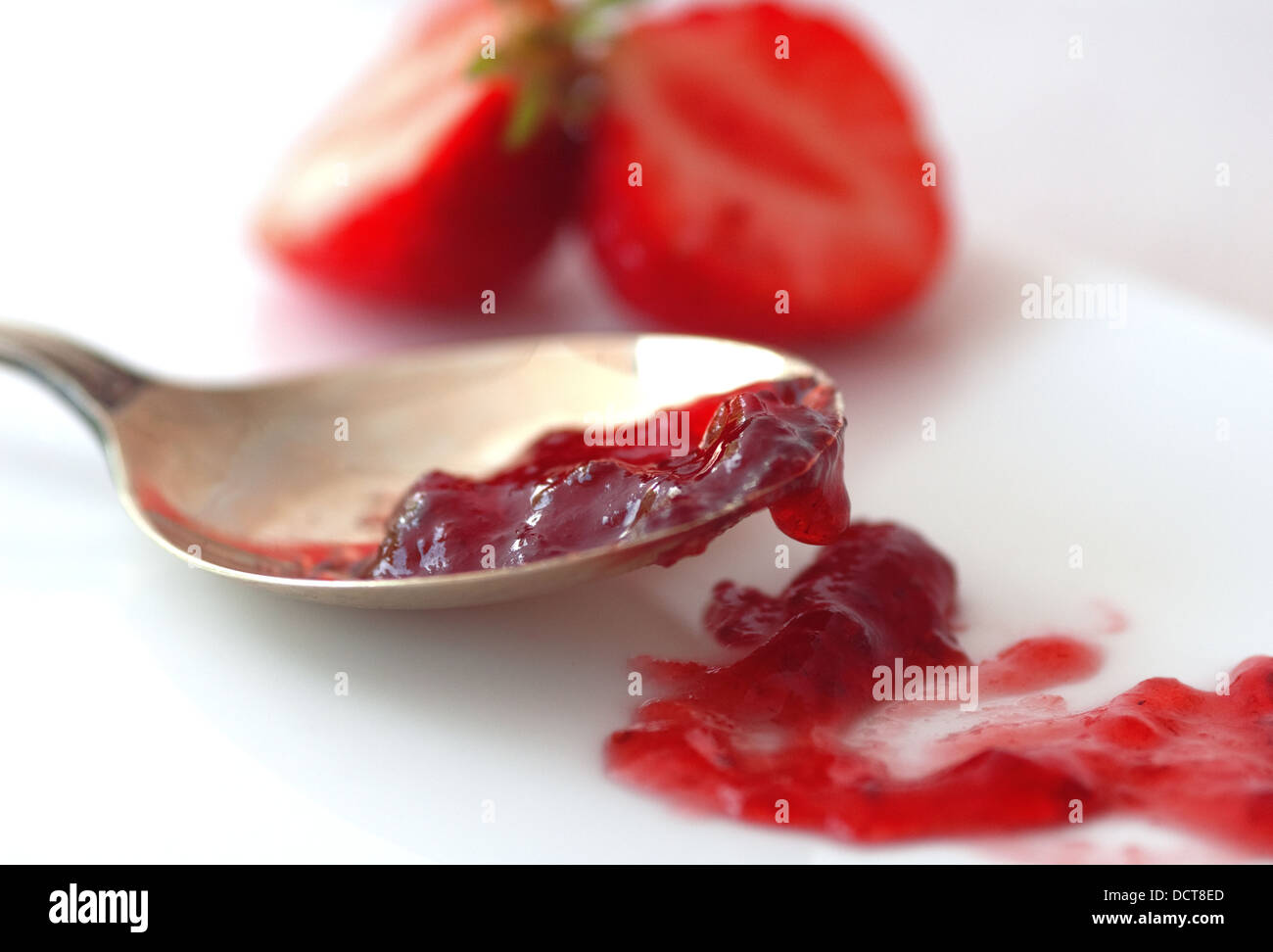 Still life food image of jam on a spoon Stock Photo - Alamy