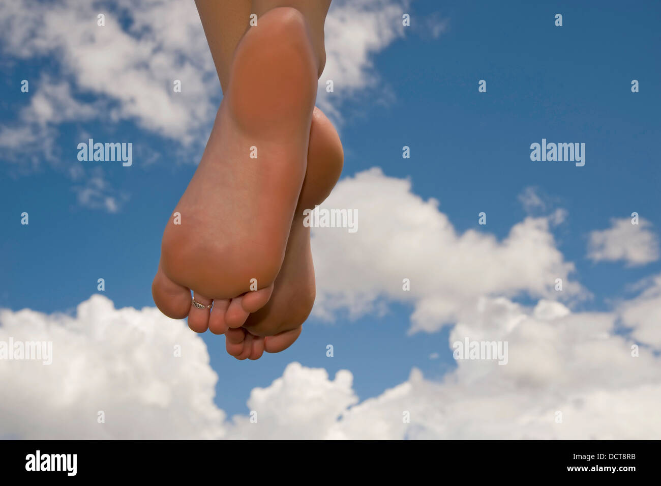 Angel Concept; Feet Floating In Sky Against Clouds Stock Photo - Alamy