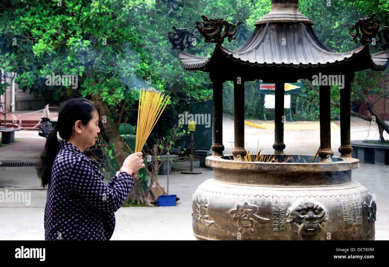 Woman praying at lake hi-res stock photography and images - Alamy
