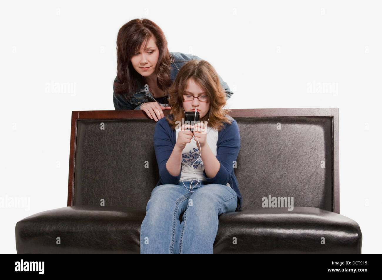 Concerned mother watching daughter hi-res stock photography and images ...