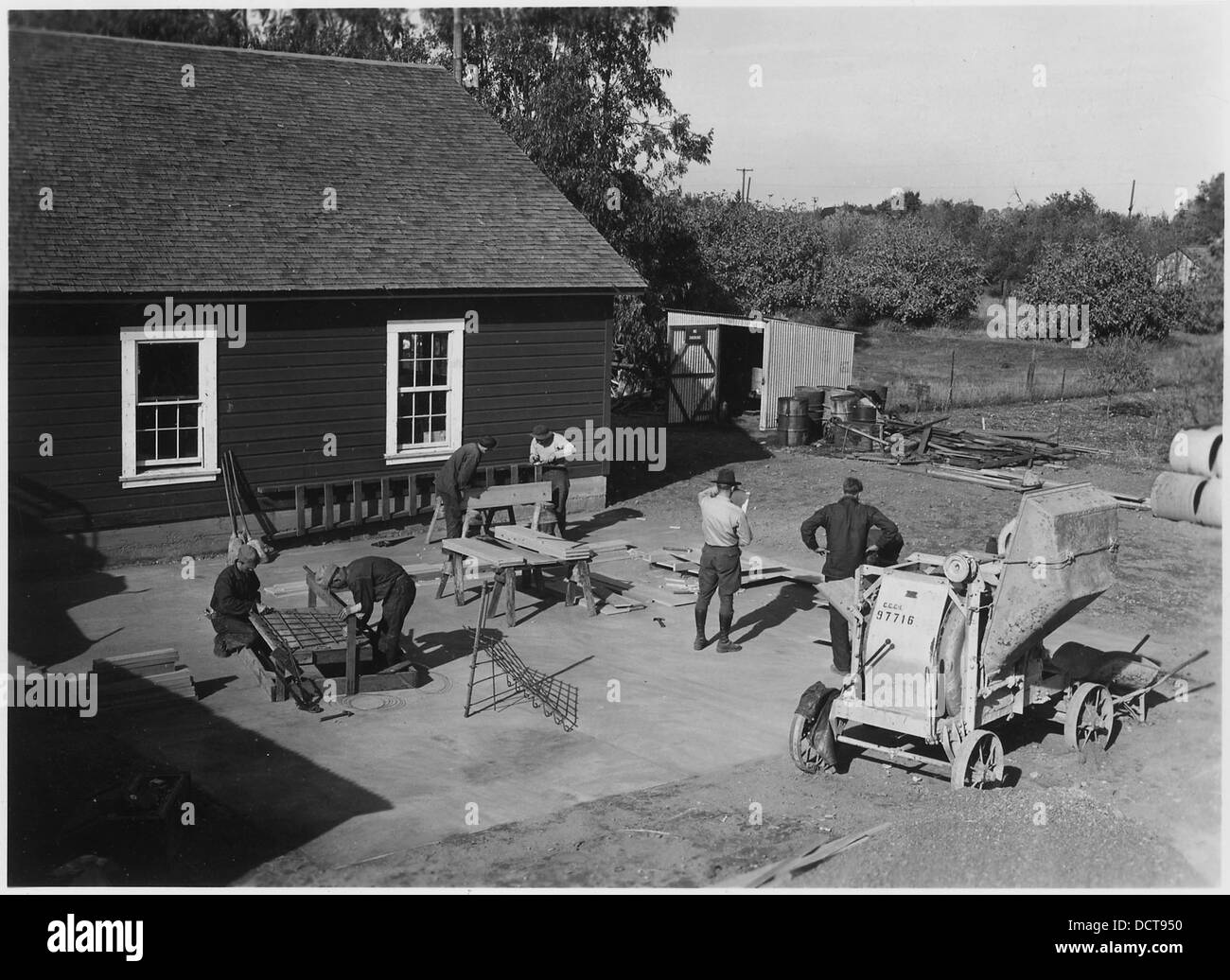 A crew of six workers from the Civilian Conservation Corps (CCC) is ...