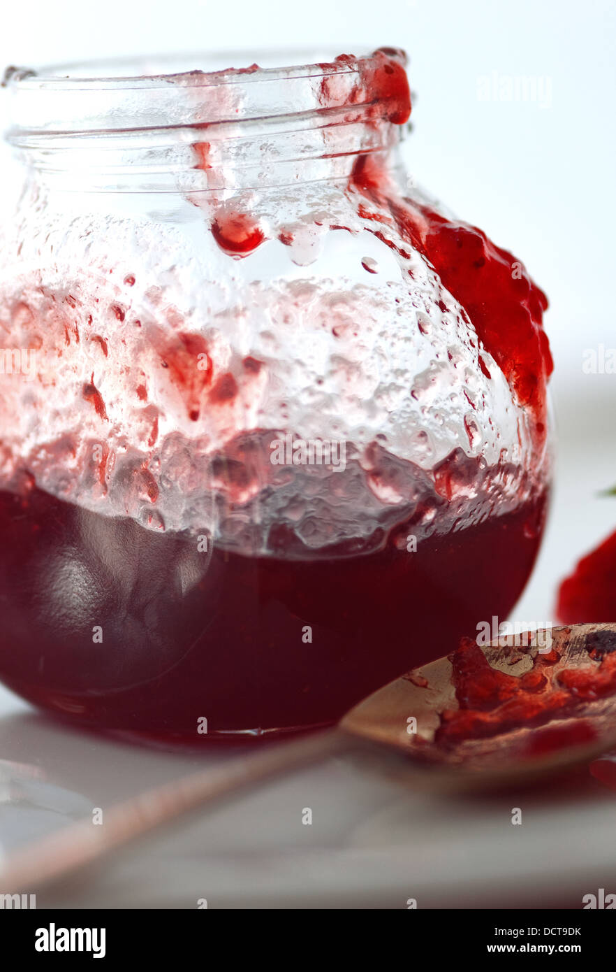 Still life food image of strawberry jam and jam jar Stock Photo - Alamy