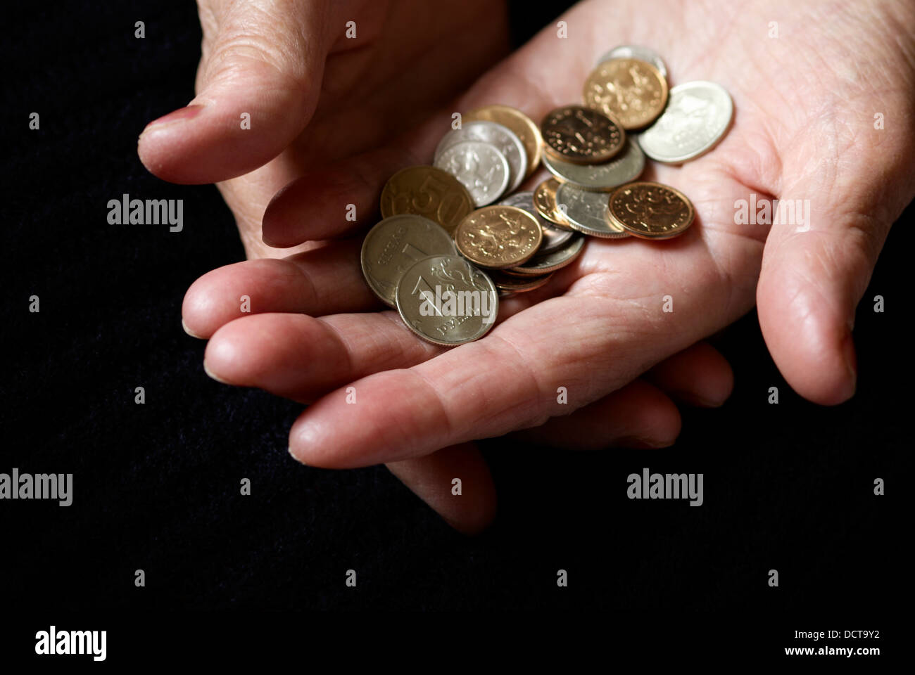 Old coin hands hi-res stock photography and images - Alamy