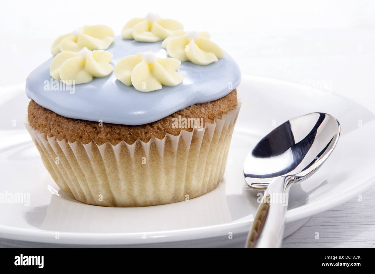 cupcake with blue icing decoration Stock Photo - Alamy