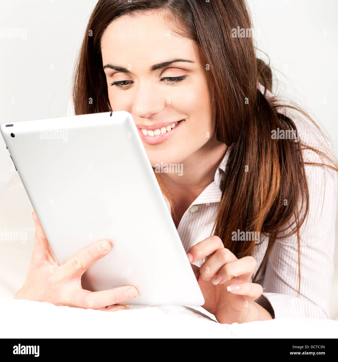 Beautiful smiling woman with tablet Stock Photo - Alamy