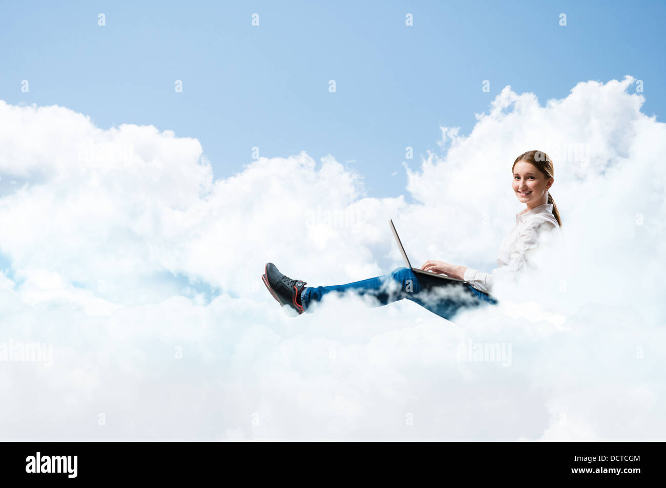 young girl running in the clouds with a laptop Stock Photo - Alamy
