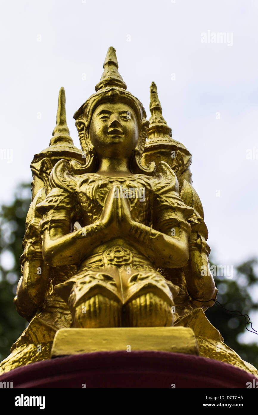 Sitting deva statue Stock Photo - Alamy