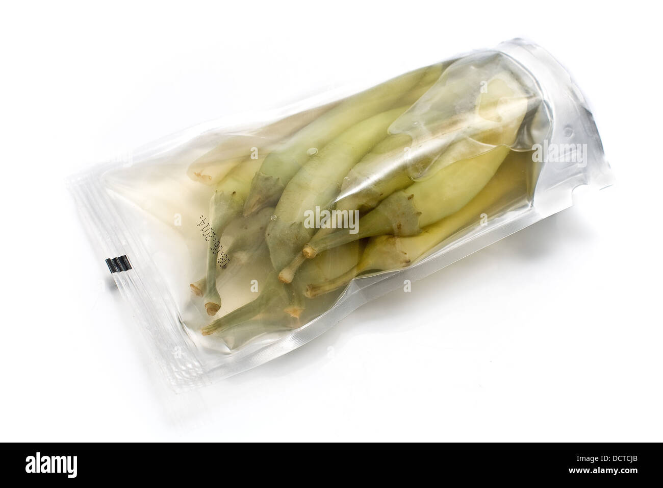 Hot chili peppers in plastic packaging on white Stock Photo - Alamy