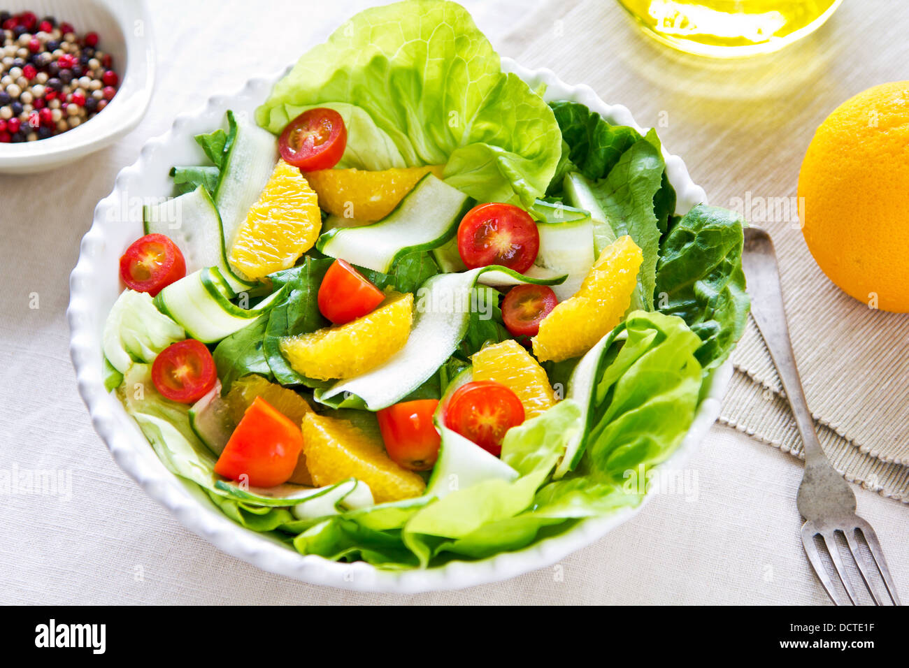Fresh Orange with cherry tomato and lettuce salad Stock Photo - Alamy