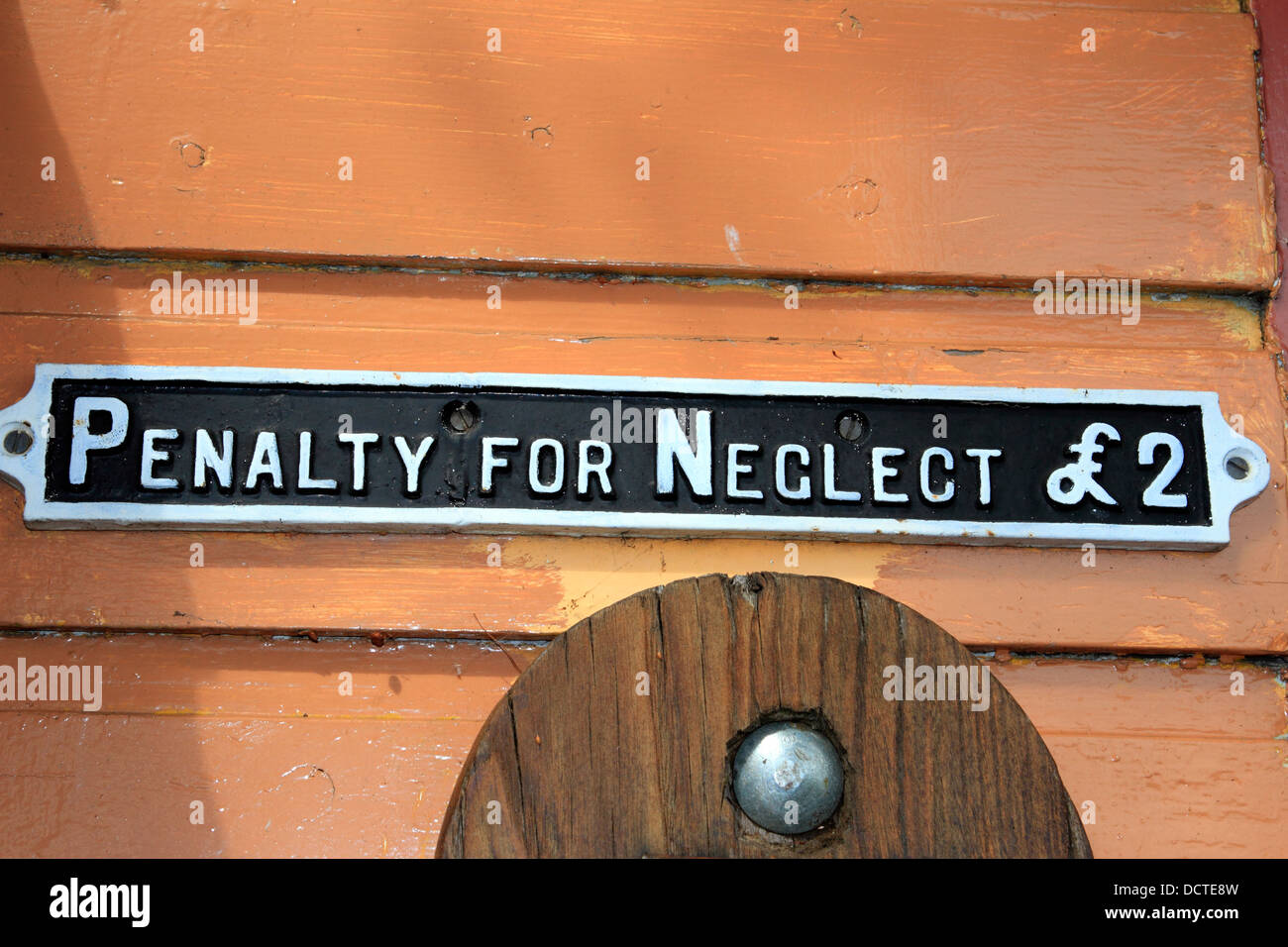 Penalty for neglect old railway sign Stock Photo - Alamy