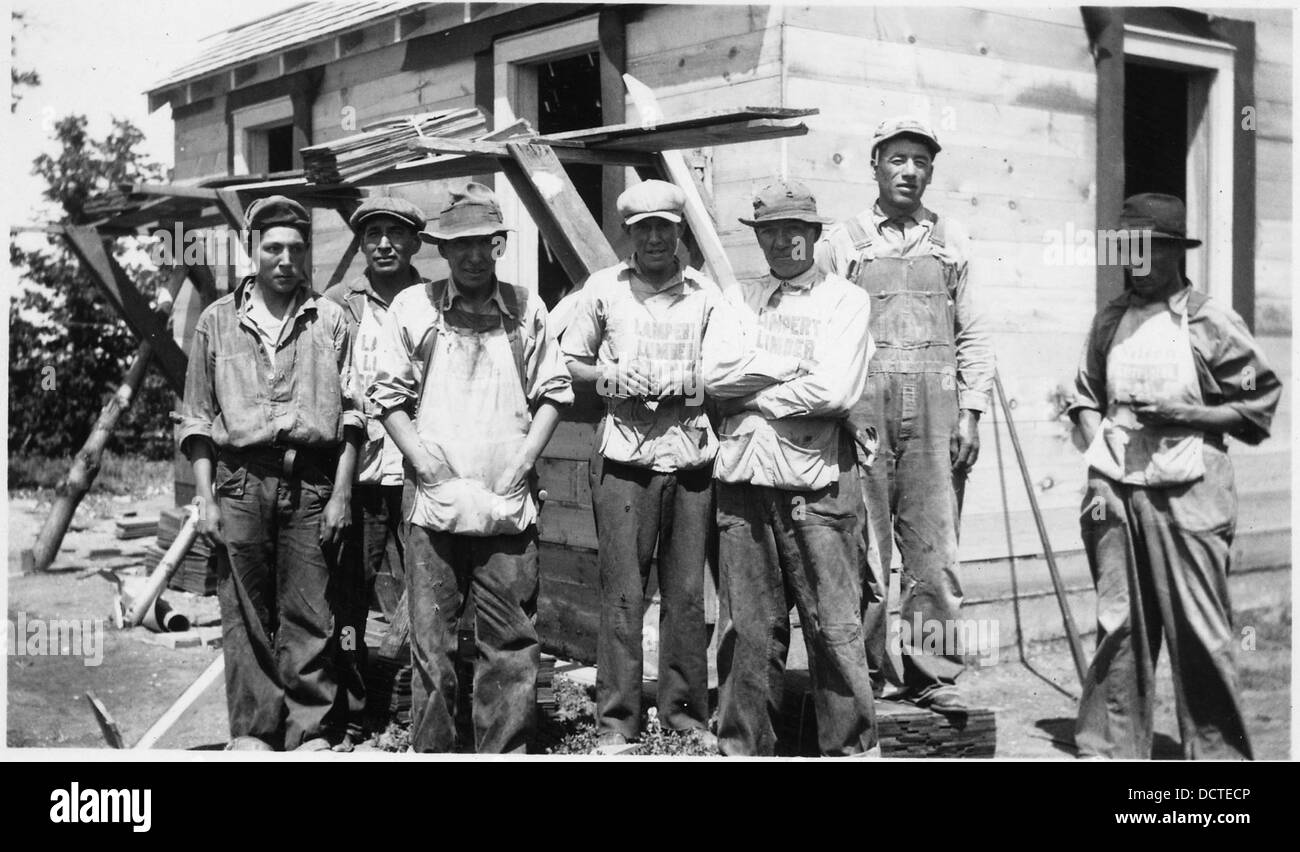 A construction crew works on a partially built house for Daniel Greeley ...