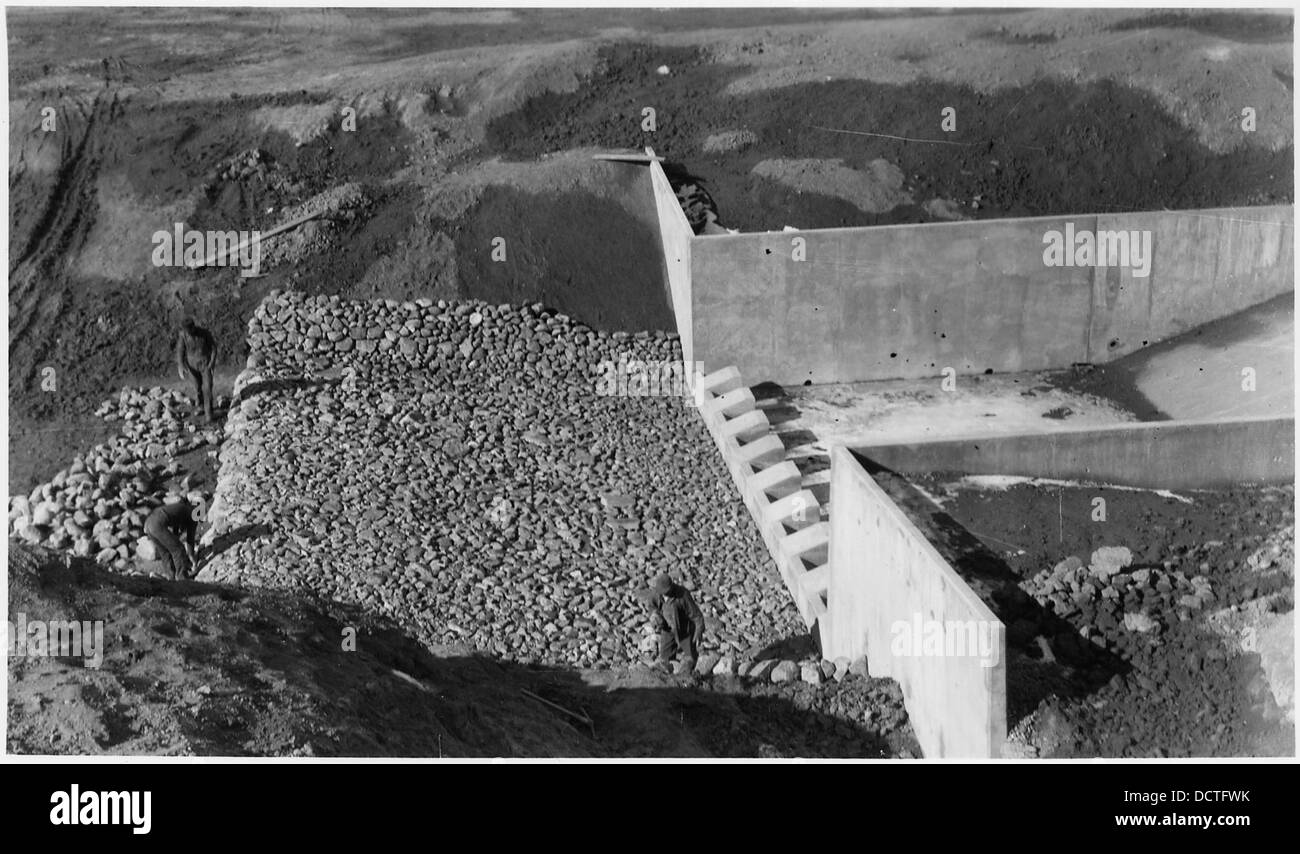This image shows the construction of a dam spillway, including a view ...