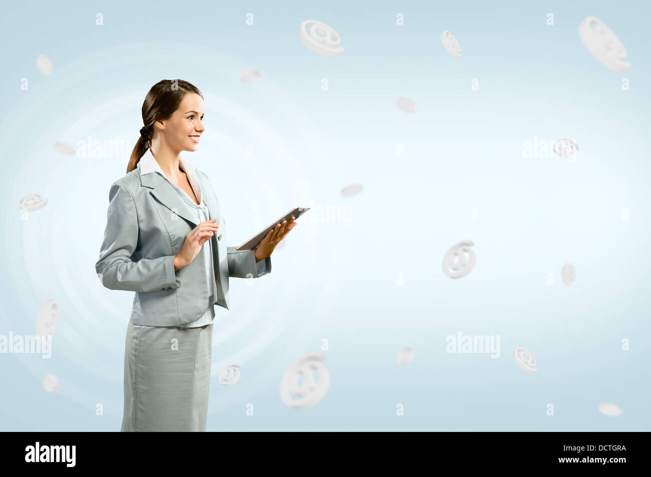 attractive business woman holding a table Stock Photo - Alamy