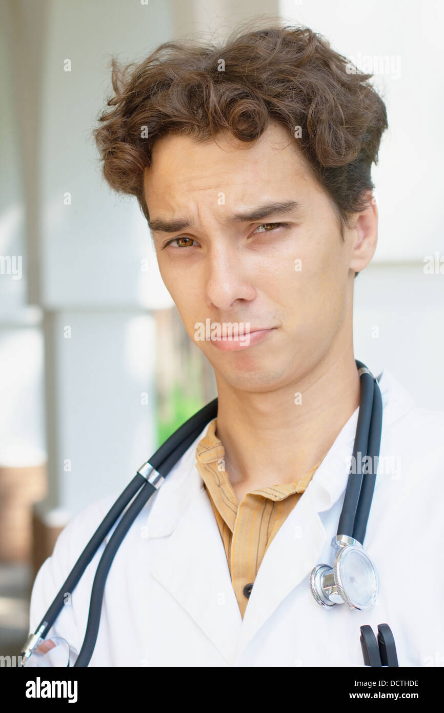 Upset young doctor Stock Photo - Alamy